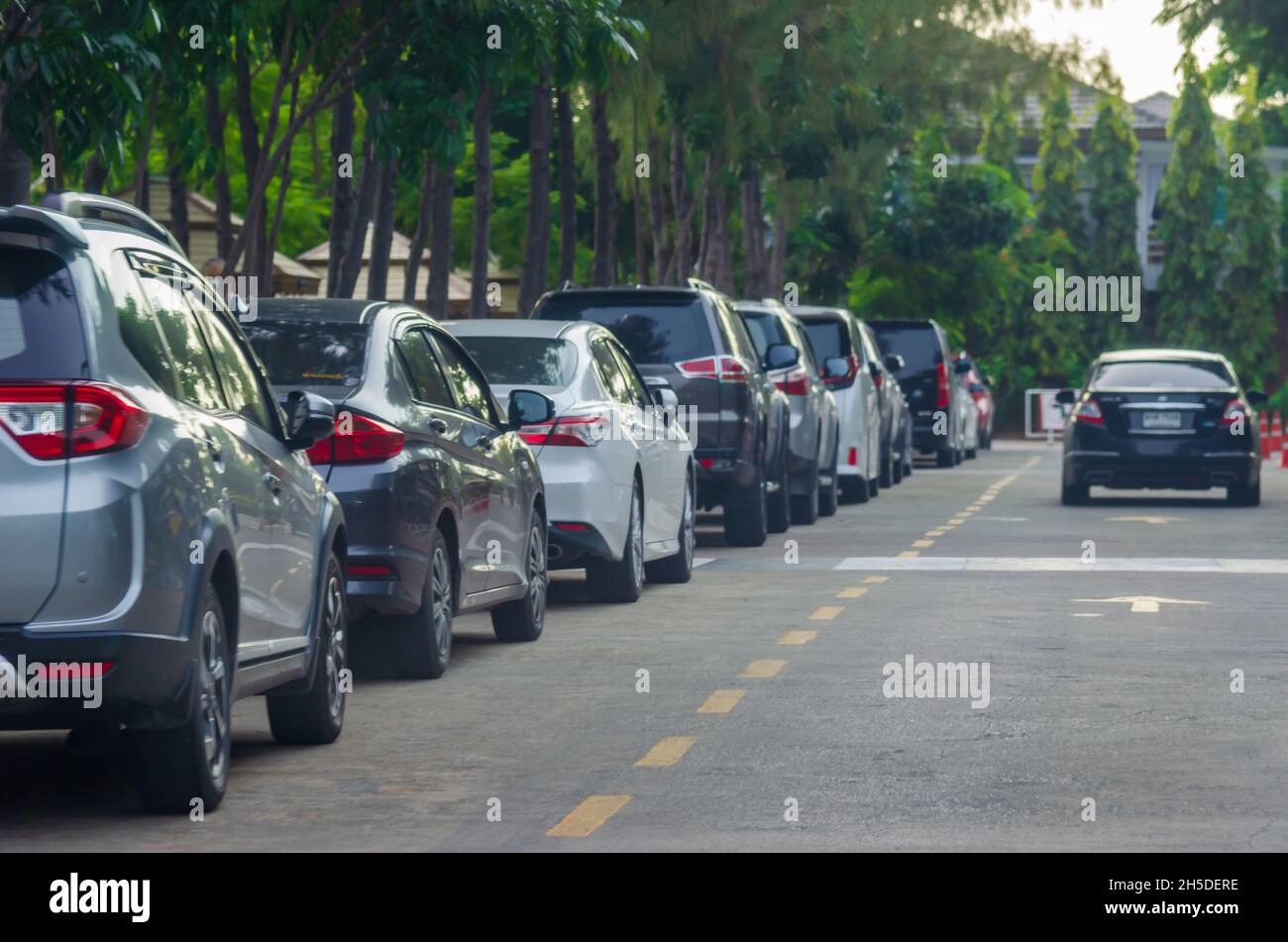 Row of car parked on the roadside Stock Photo - Alamy