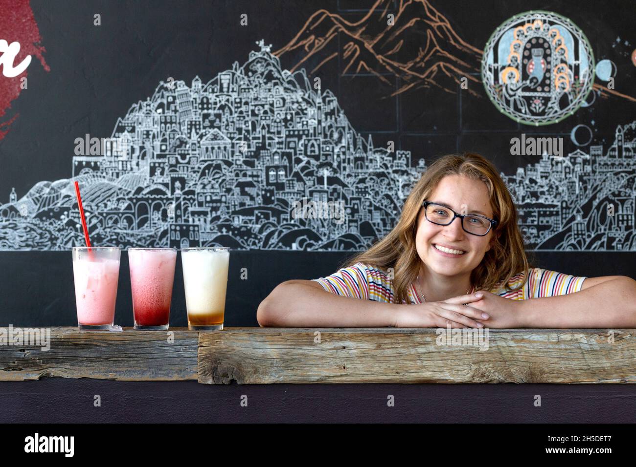 PROVO, UNITED STATES - Oct 06, 2018: A smiling girl with glasses next ...