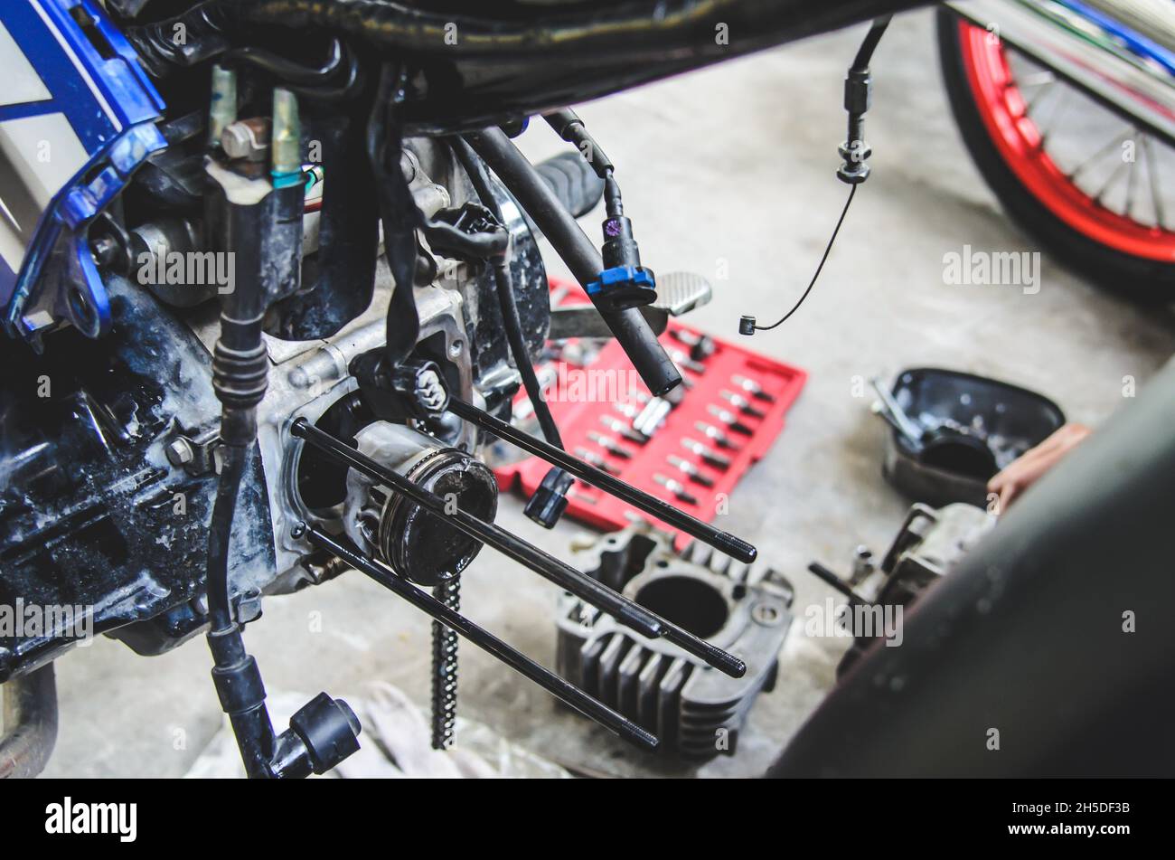 Mechanical repairs engine motorcycle Stock Photo - Alamy