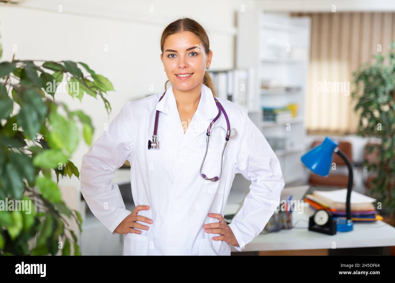Female doctor standing in hall of clinic Stock Photo - Alamy