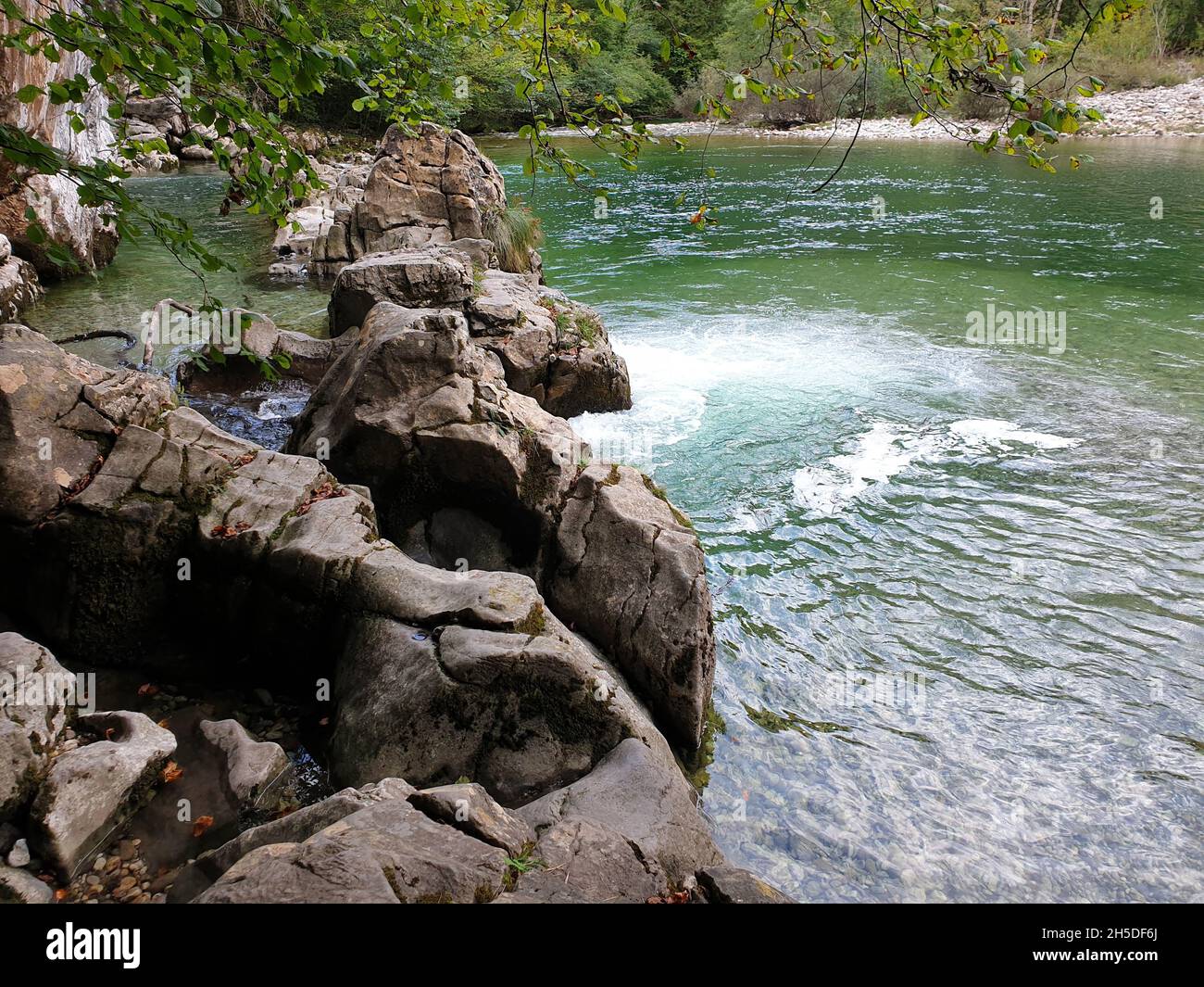 Beautiful view of a river ad big rocks in San Vicente pot in Asturias ...