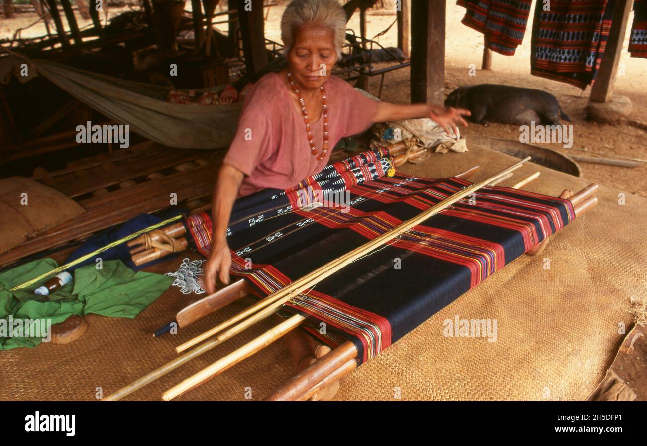 Laos: Brao weaver with foot loom, Bolaven Plateau, Champasak Province ...