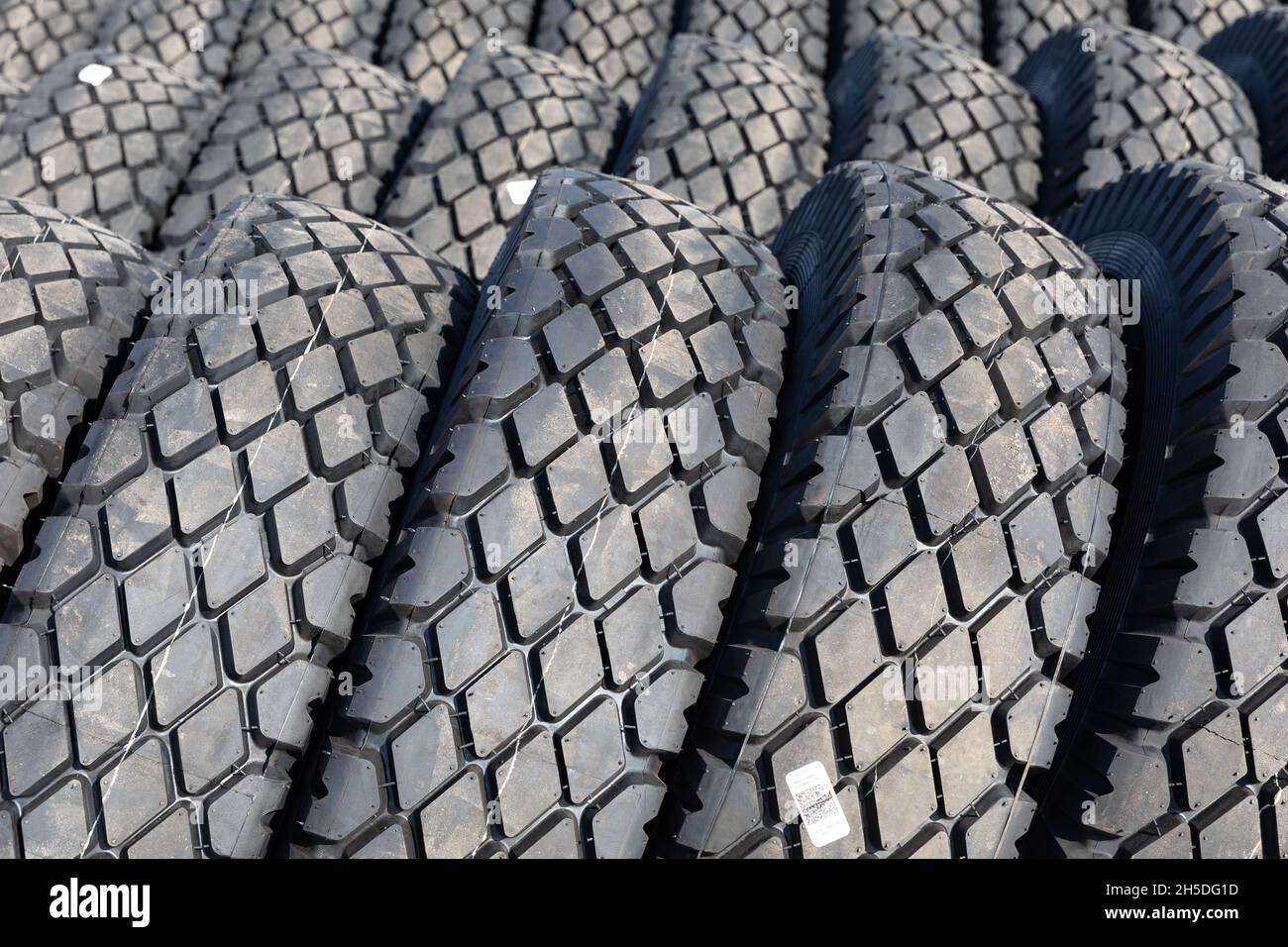 Photo of black big tires on wheels for large cars Stock Photo - Alamy