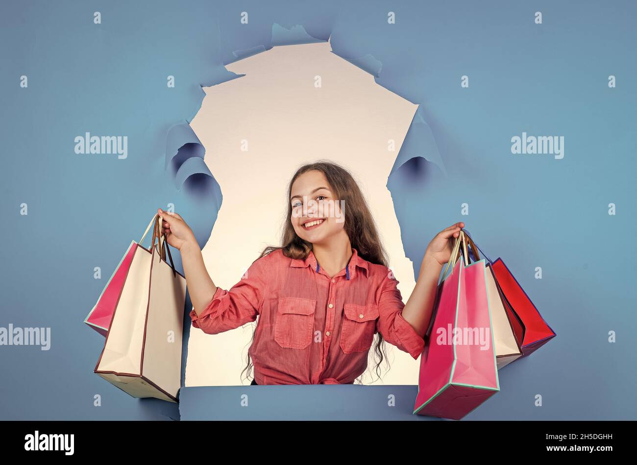trendy looking kid girl with packages presents, shopping time Stock ...