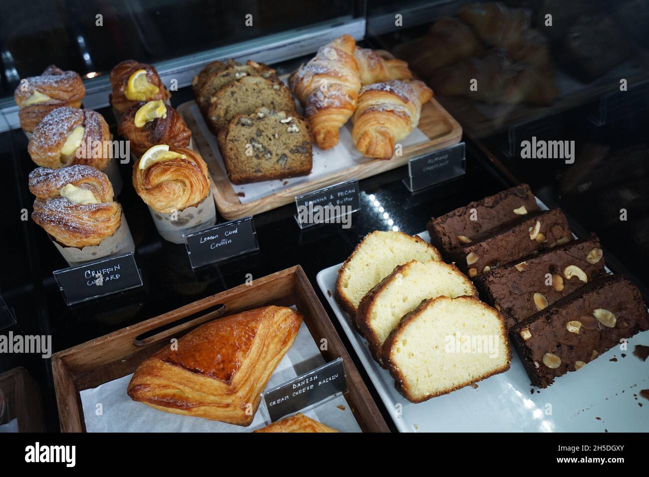 Assorted cake pastry and desserts displayed in case box Stock Photo - Alamy