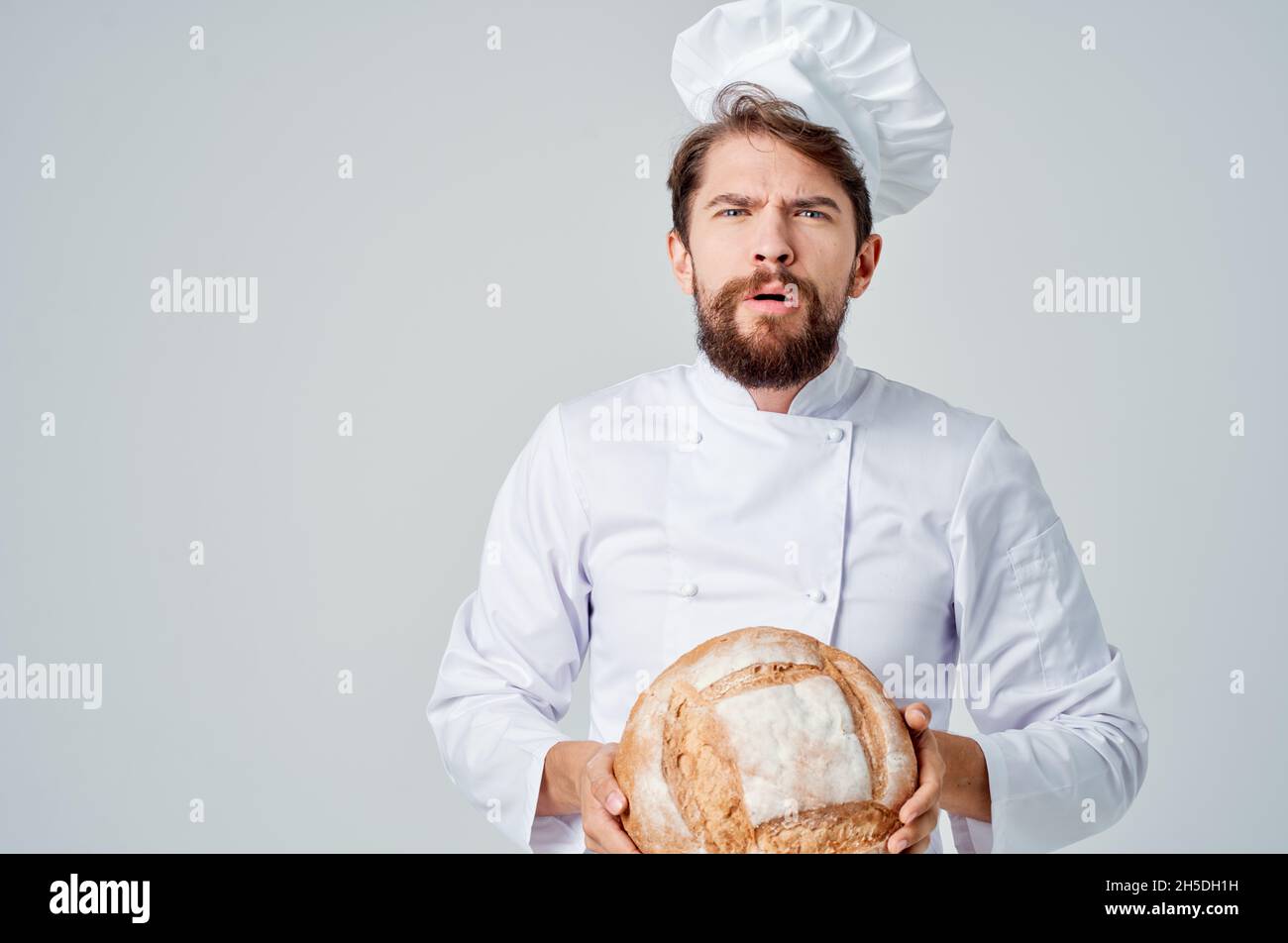 Chef with bread in hand Professional emotions Stock Photo - Alamy