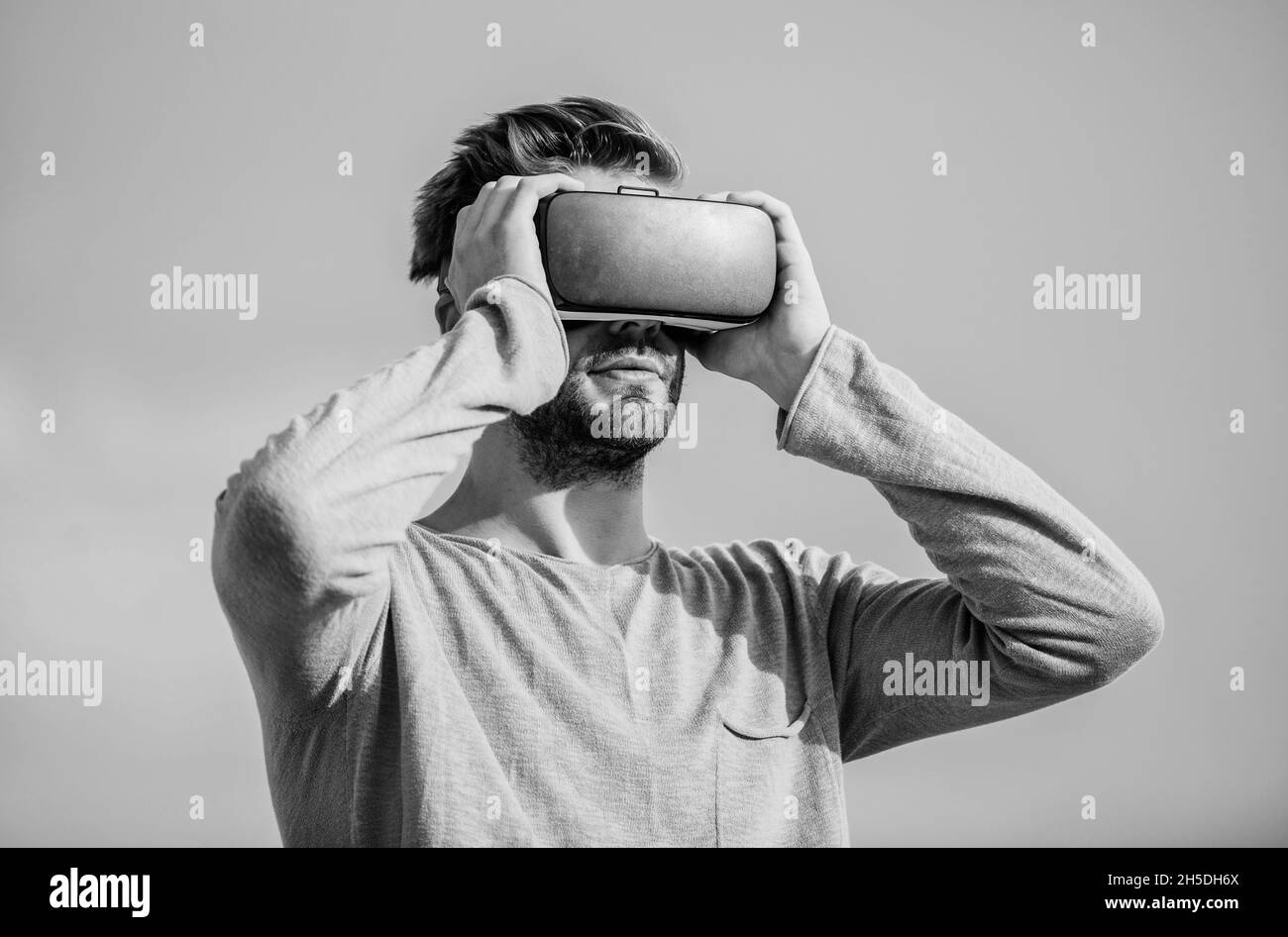 Virtual reality goggles. Handsome man with wireless VR glasses headset ...