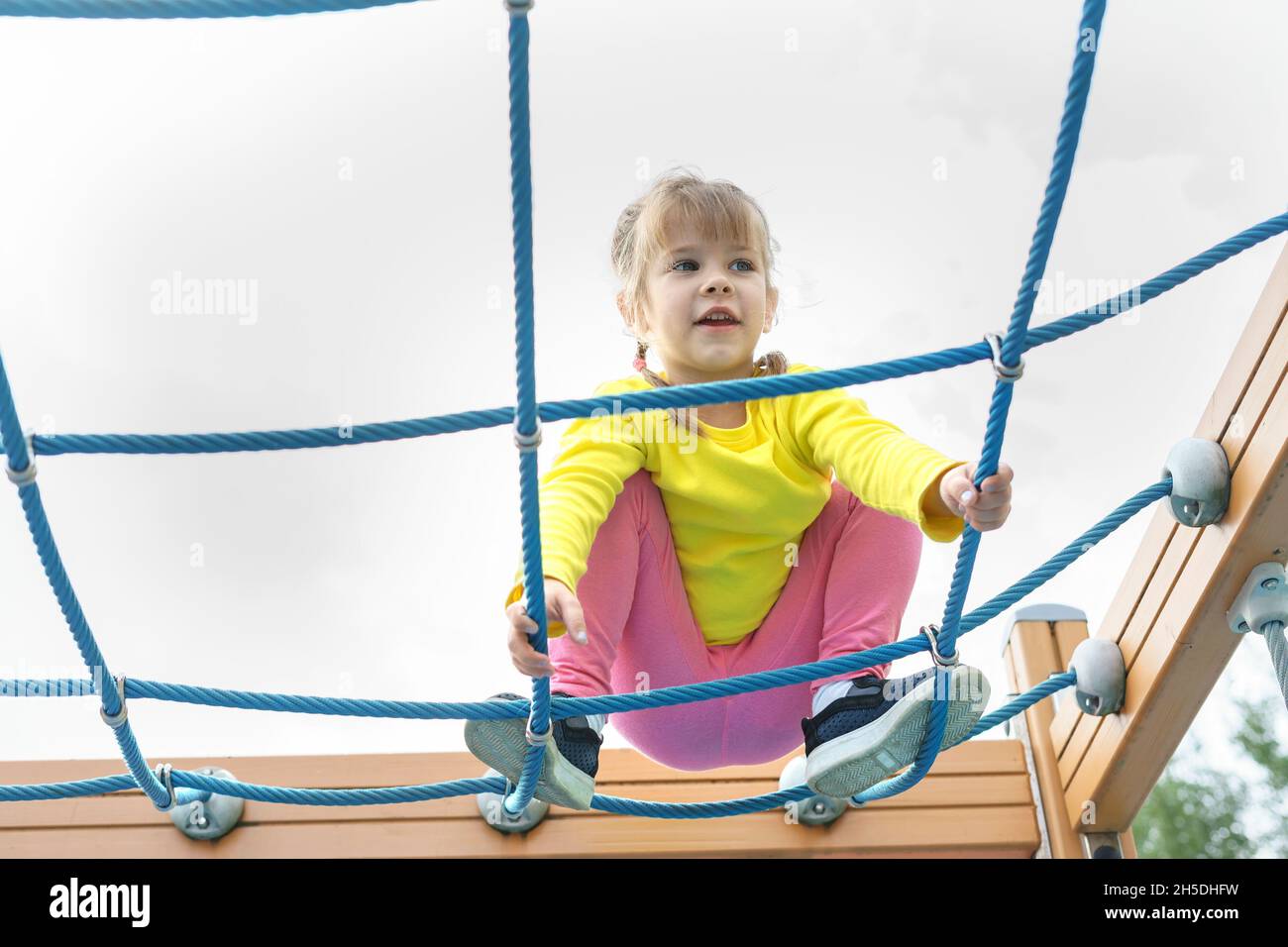 cute baby playing and climbing on the playground. Physical, Hand ...
