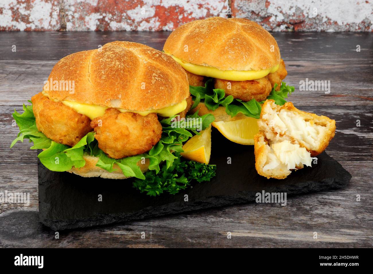 Battered cod fish nugget sandwiches with mayonnaise and lettuce in ...