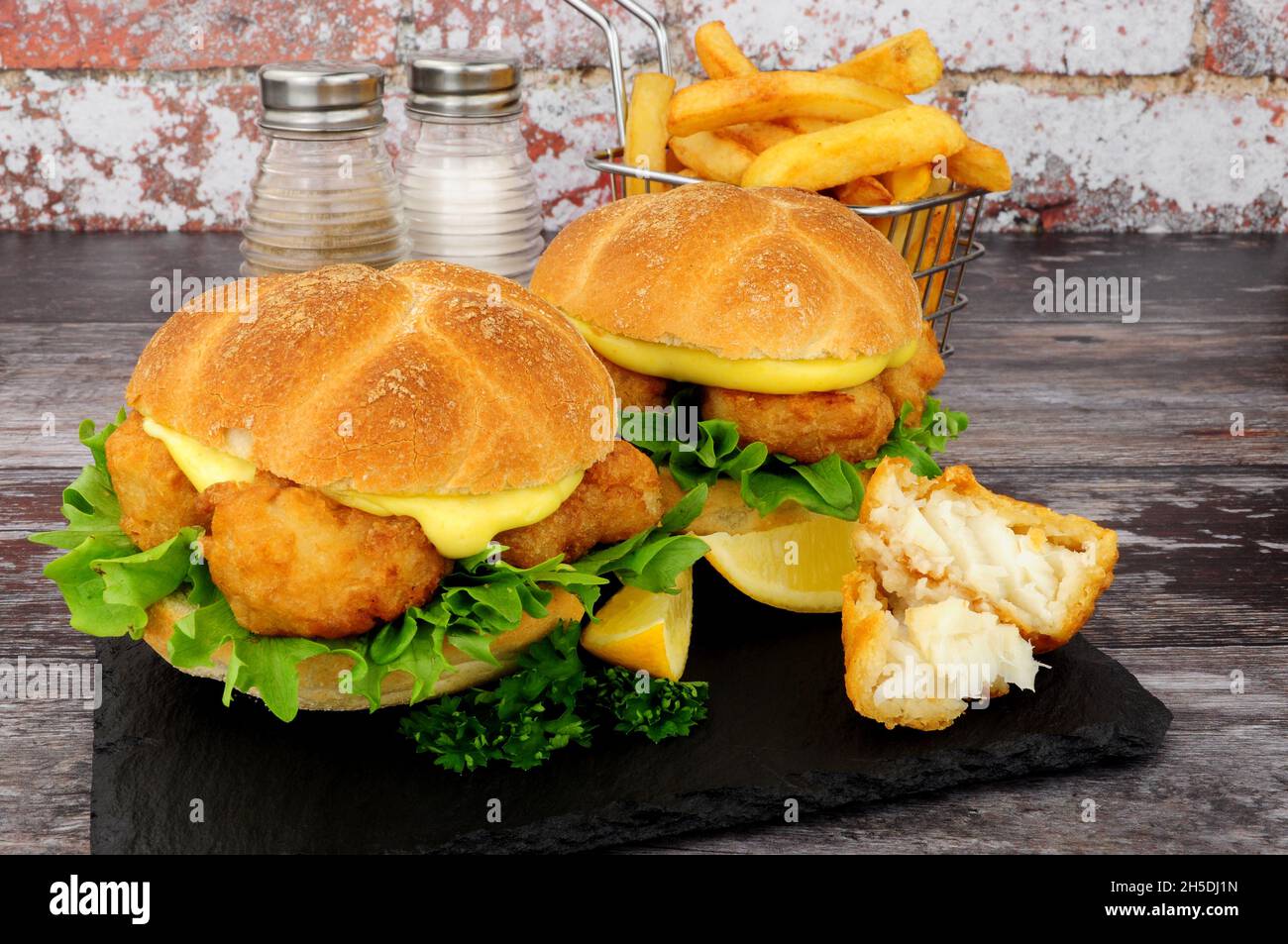 Battered cod fish nugget sandwiches with mayonnaise and lettuce in ...