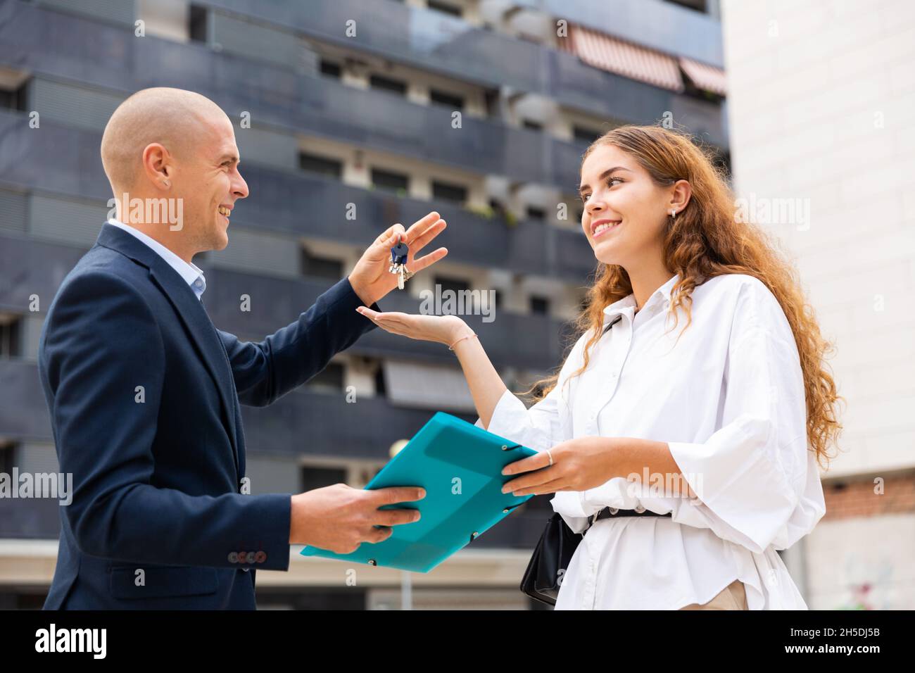 Builder giving keys to client after finishing signing contract Stock ...