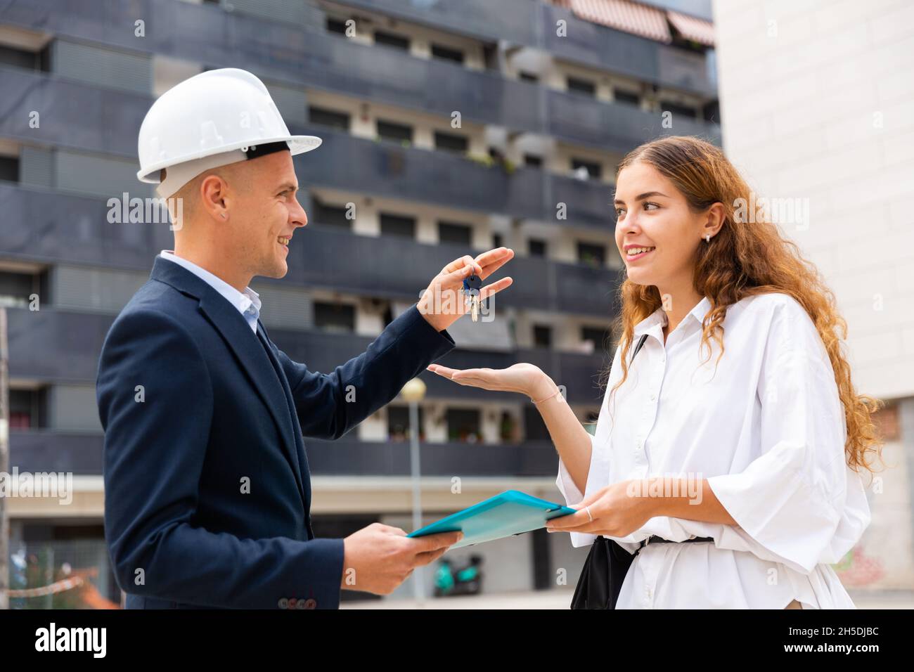 Builder giving keys to client after finishing signing contract Stock ...