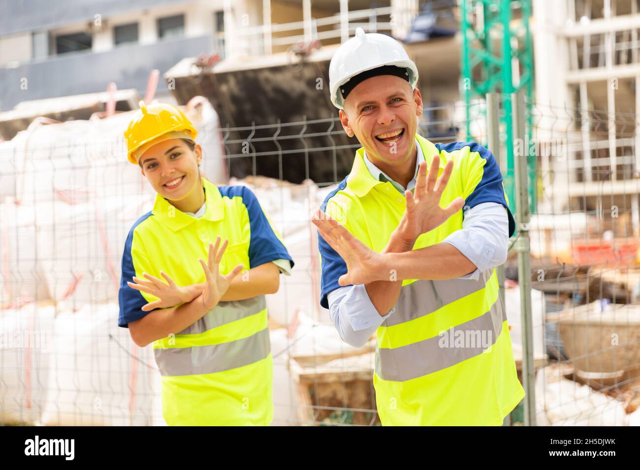 Builders dancing at construction site Stock Photo - Alamy
