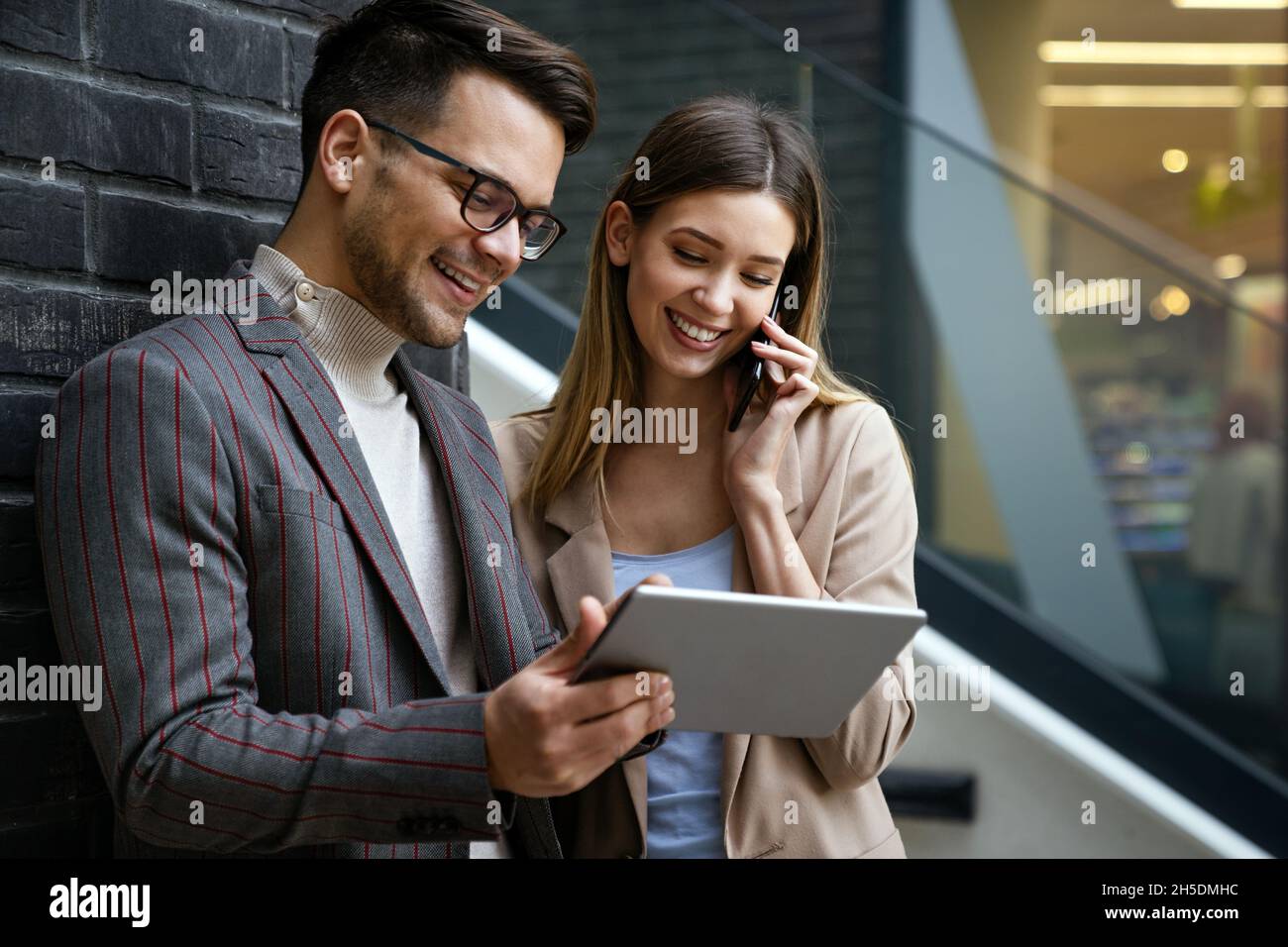Successful business colleagues people working together on digital ...