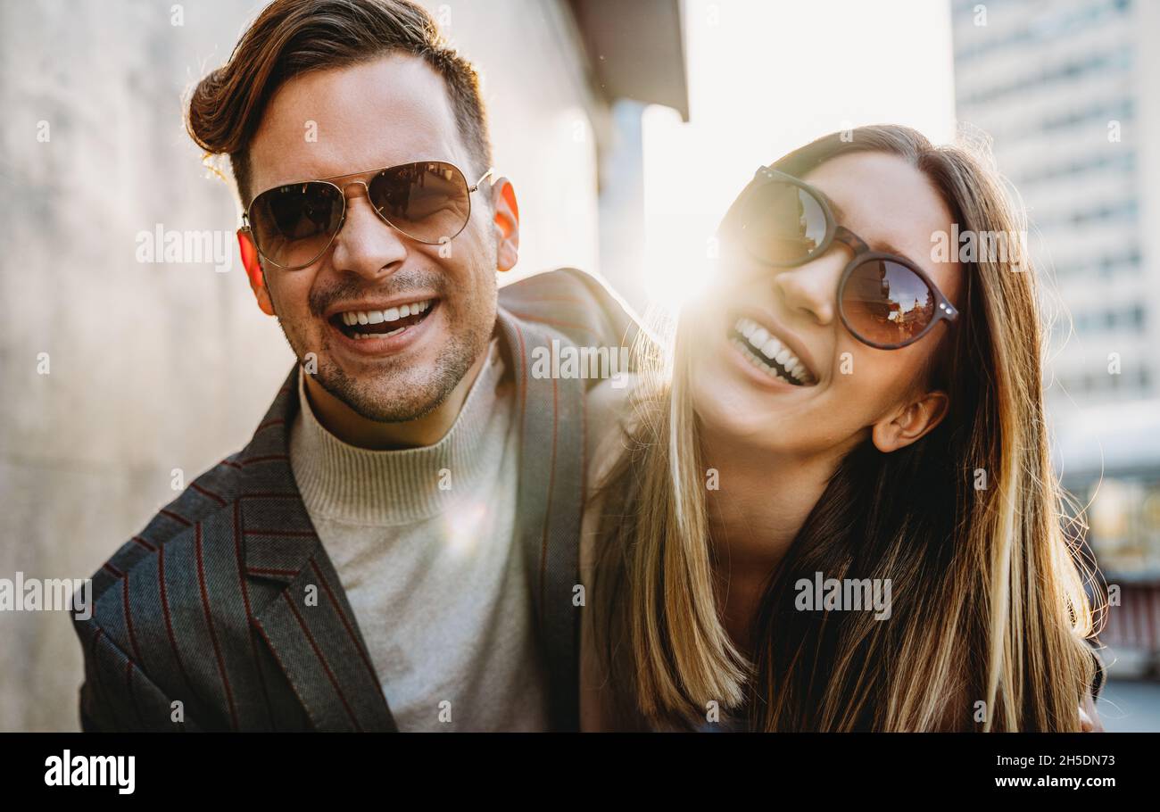 Happy successful business couple in love having fun together in urban ...