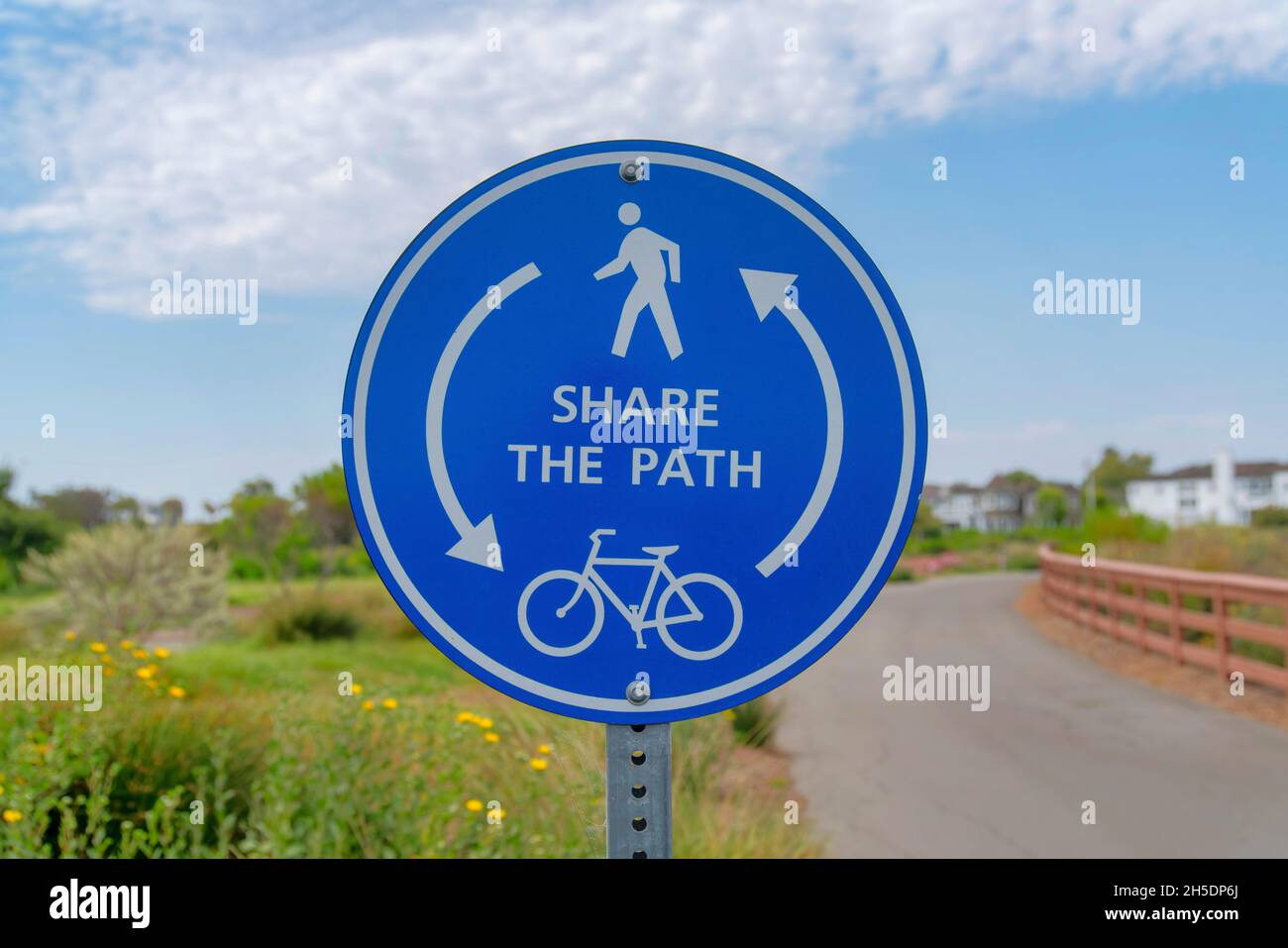 Share the Path sign on a circular road sign at the Newport Beach in ...