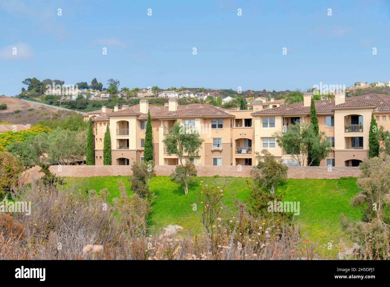 Fenced complex apartment buildings with balconies at San Diego ...