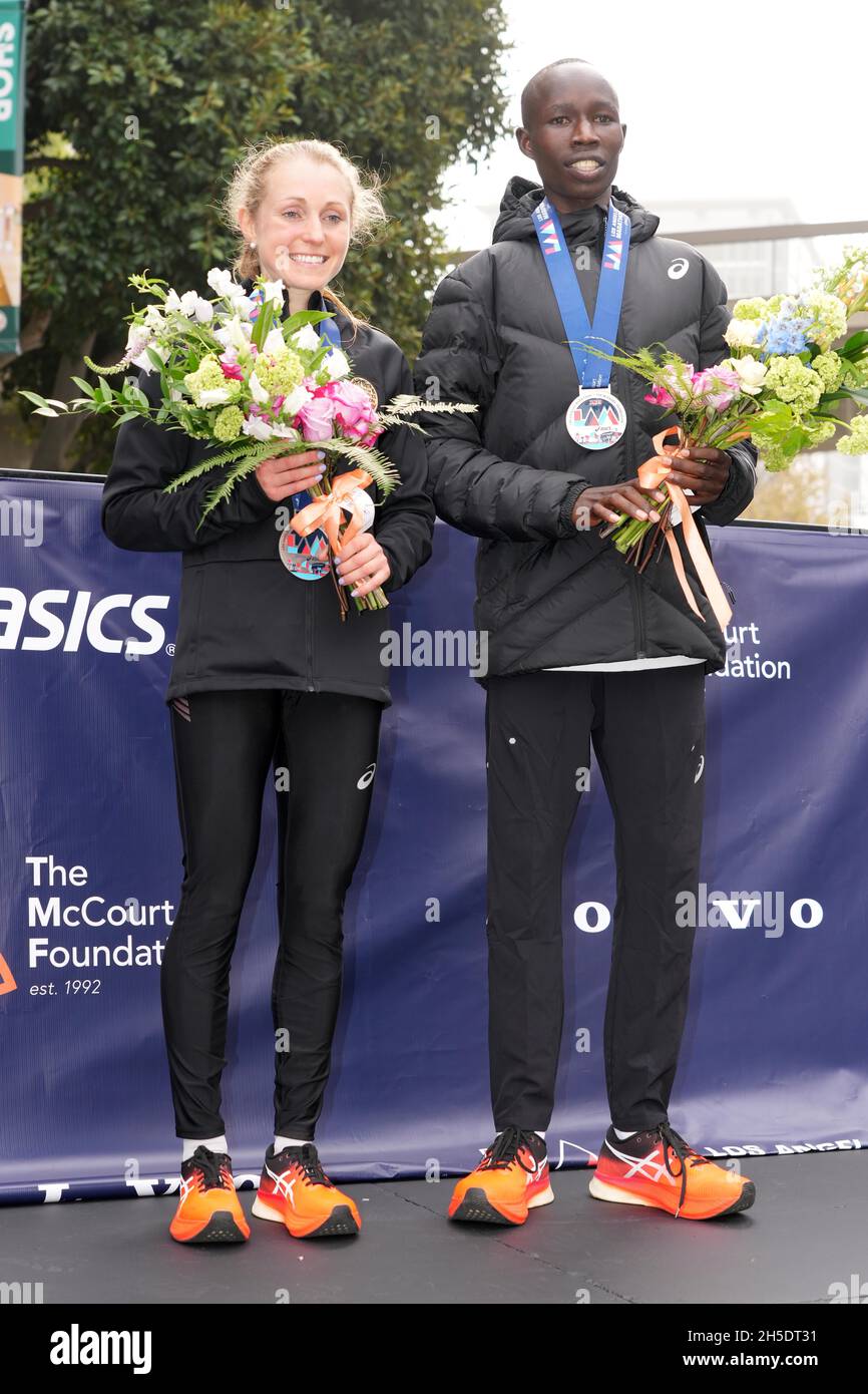 Natasha Cockram (GBR), left, and John Korir (KEN) pose after winning ...