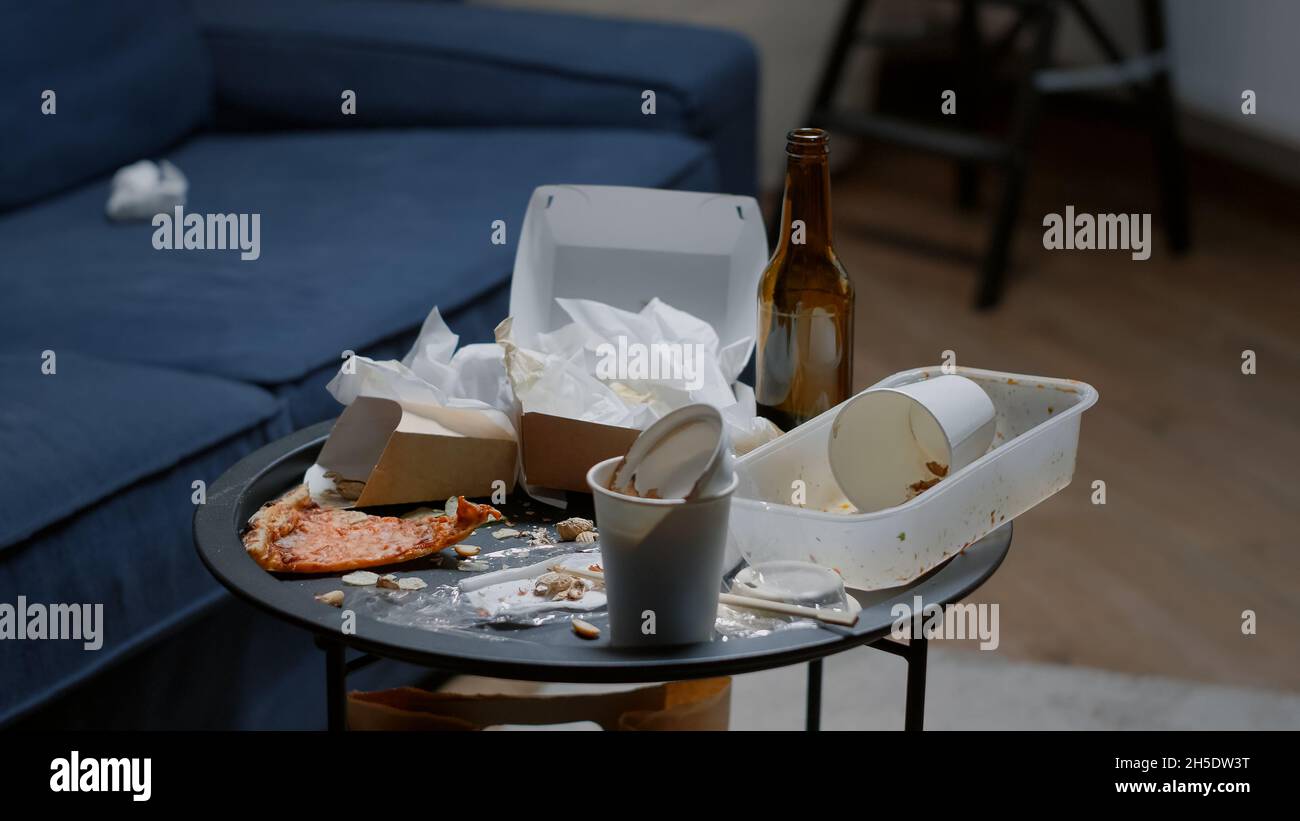 Close up of messy table, leftover food, spilled drinks, dirty dishes in ...