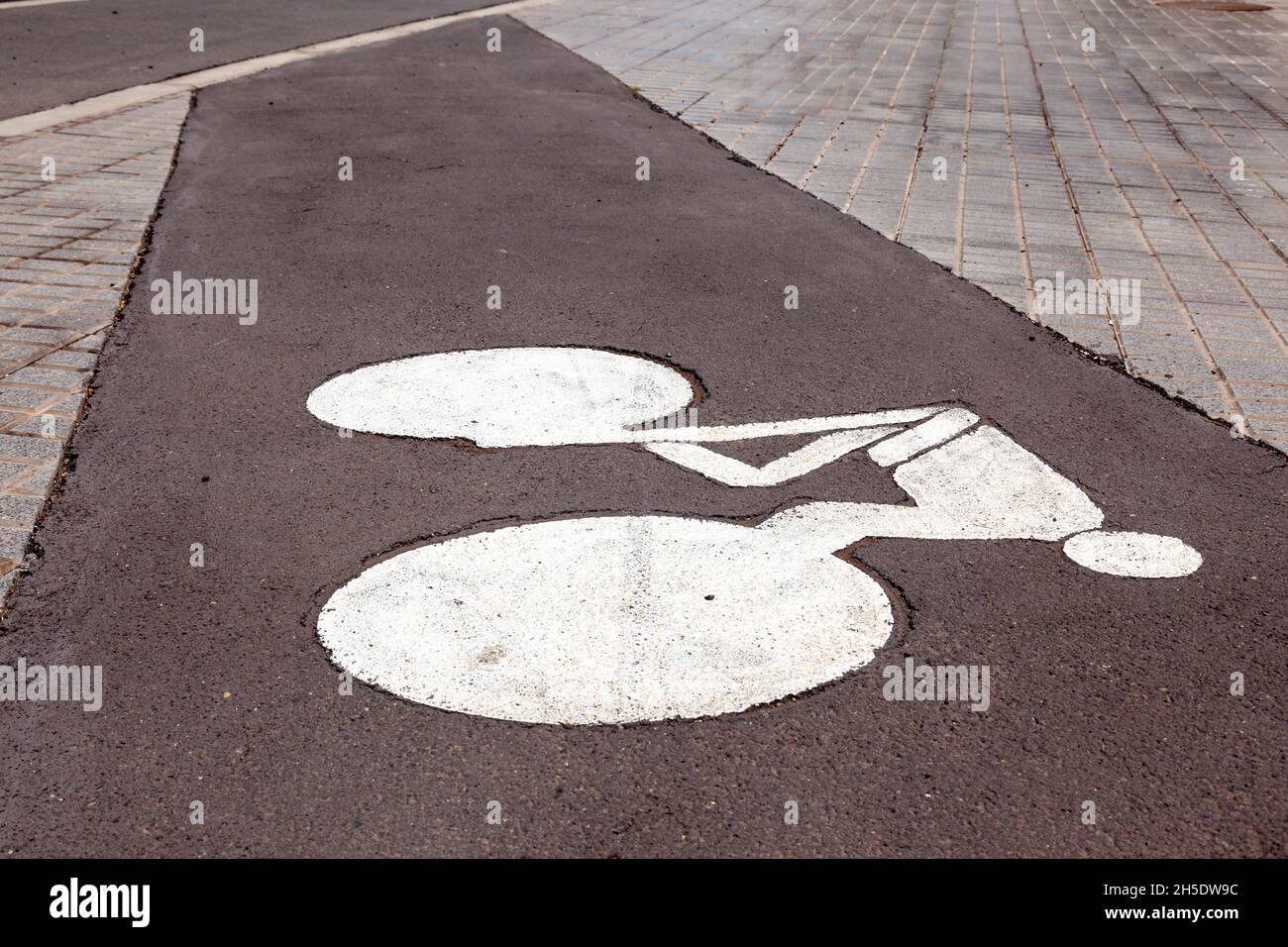 Bicycle sign on the pavement Stock Photo - Alamy