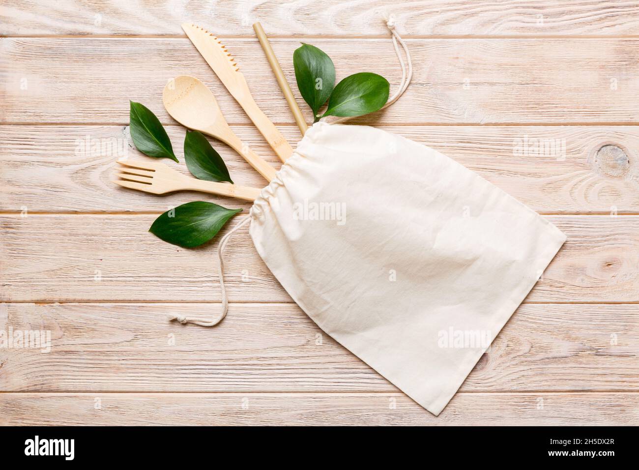 Eco friendly reusable recyclable white eco bag with kitchenware on ...