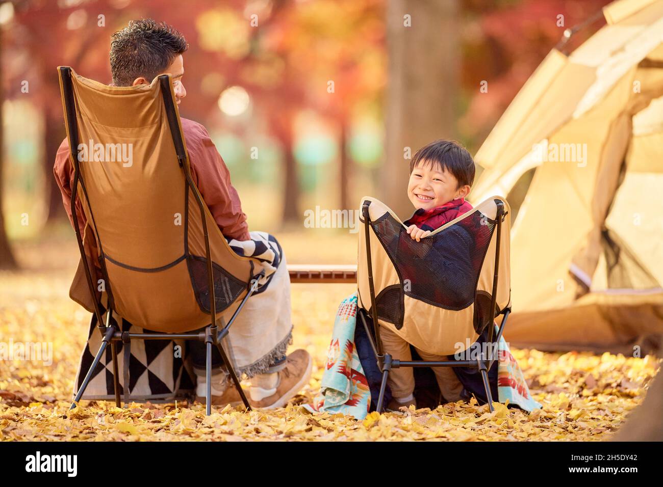 Japanese family at campsite Stock Photo - Alamy