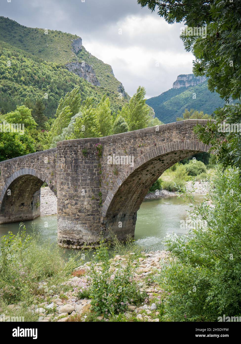 Medieval bridge over the river Esca in Burgui/Burgi, Navarre, Spain ...