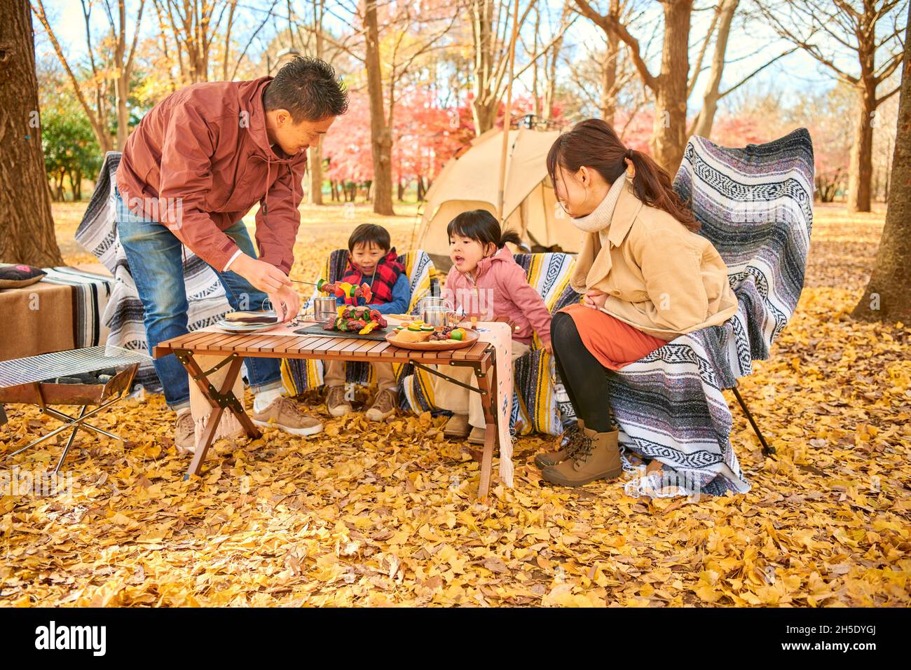 Japanese family at campsite Stock Photo - Alamy