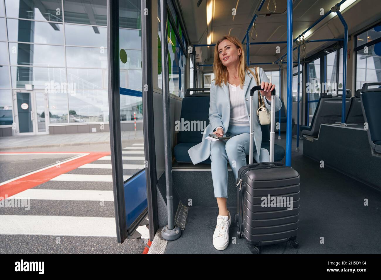 Passenger seated in transport vehicle staring into distance Stock Photo ...