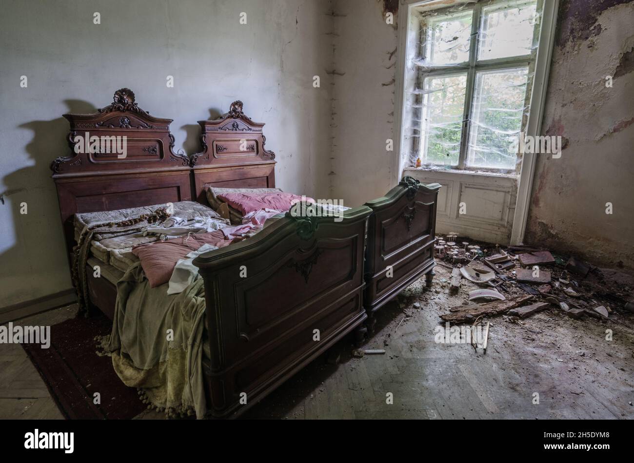 old bed with decorations in the wood in old house Stock Photo - Alamy