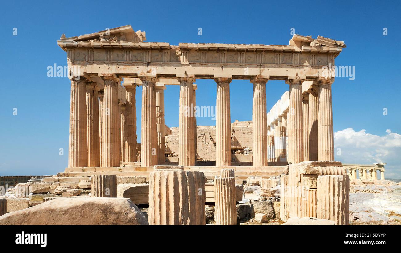 Parthenon temple on a bright day with blue sky and clouds. Panoramic ...