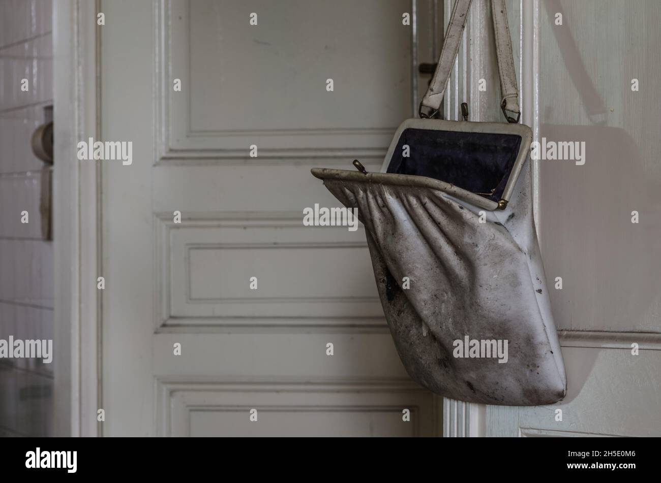 old bag hanging on a door Stock Photo - Alamy