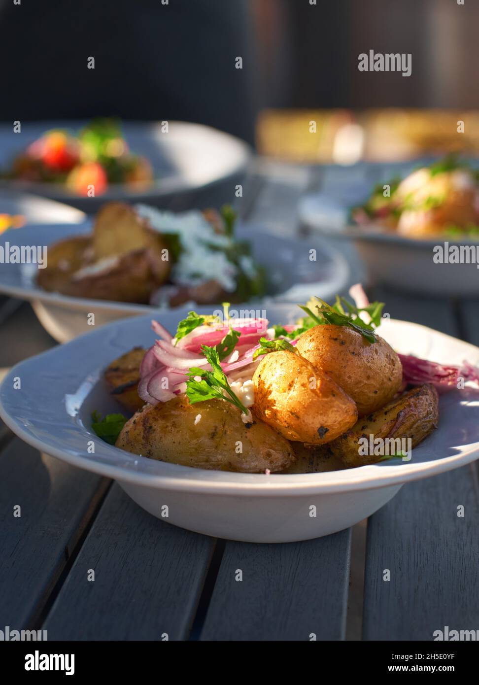 Tasty potato wedges. Fast food take away. Fried potatoes at rustic ...