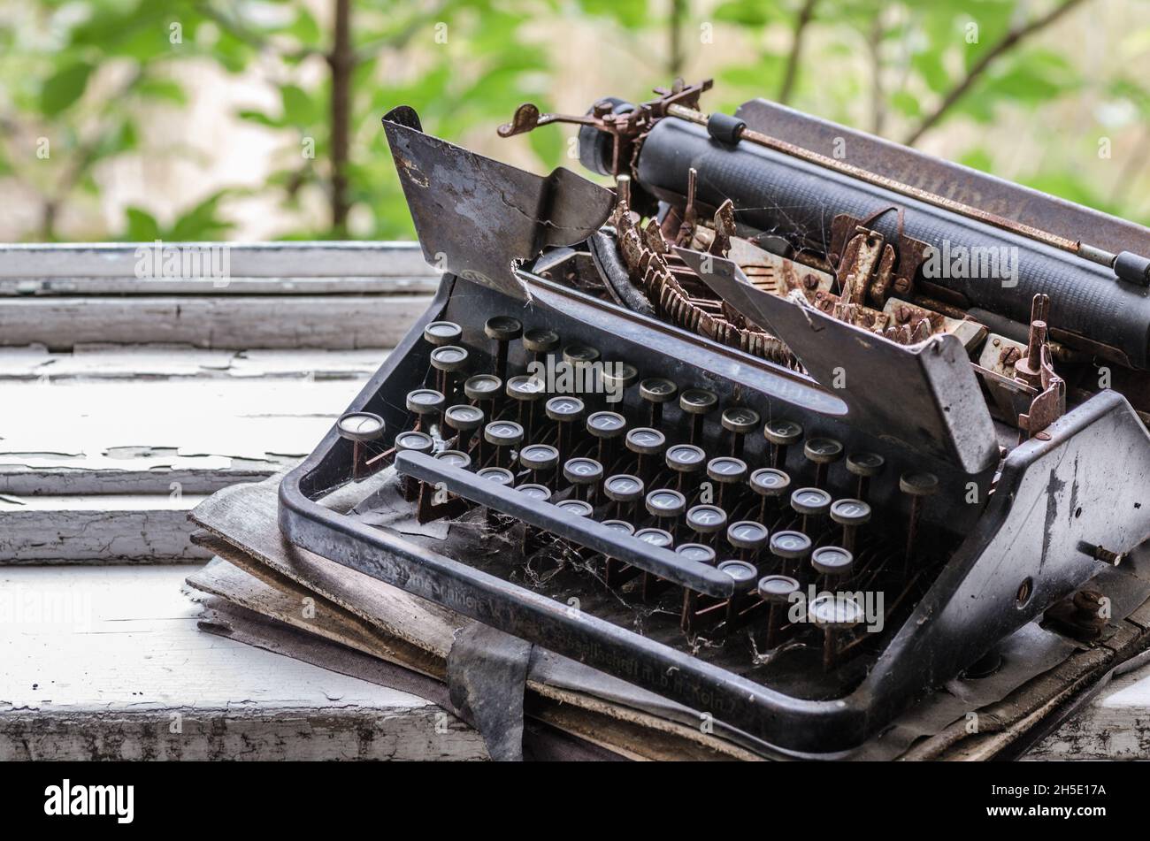 old typewriter on a window in house Stock Photo - Alamy