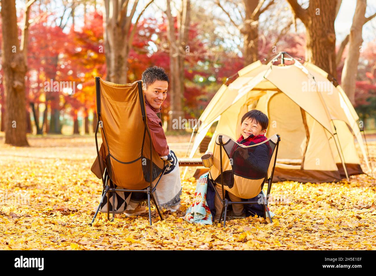 Japanese family at campsite Stock Photo - Alamy