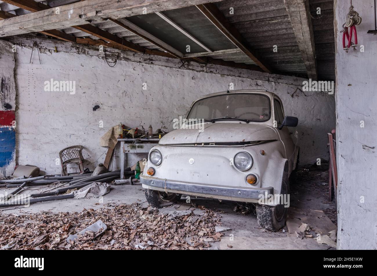 small classic car hidden in a garage Stock Photo - Alamy