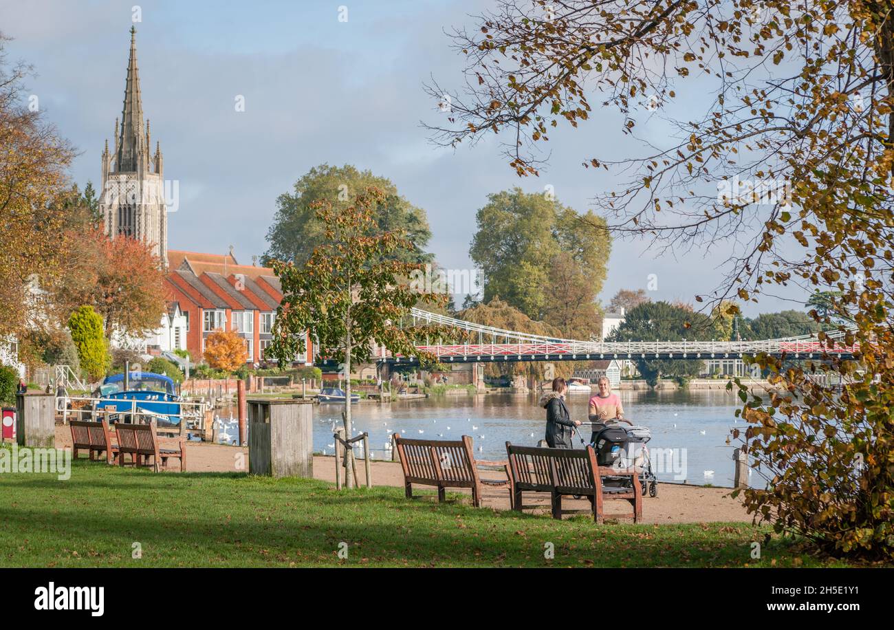 Two young Mothers with push chairs, enjoying an Autumn morning walk by ...