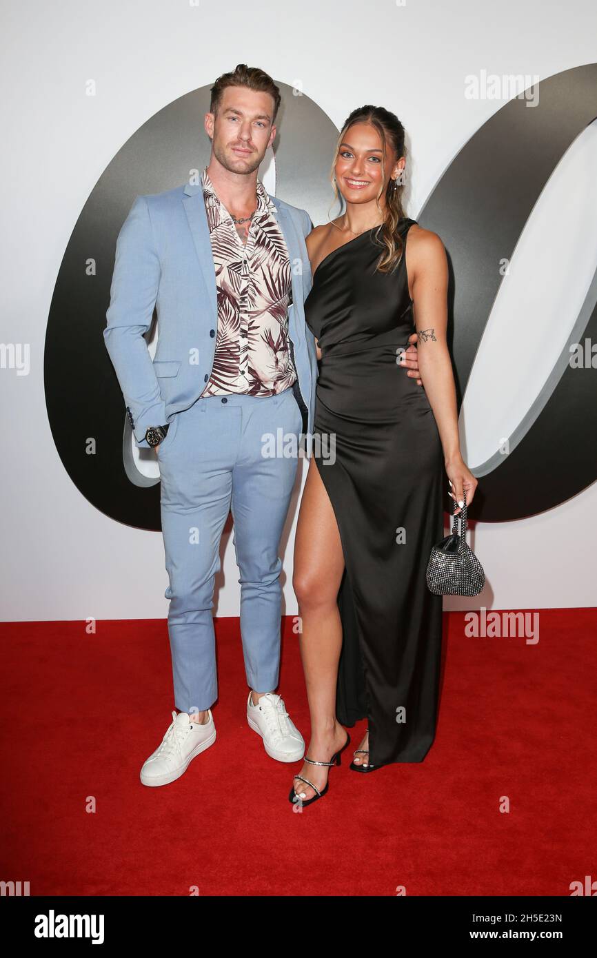 November 9, 2021: CHAD HURST and partner attending the Sydney Premiere ...