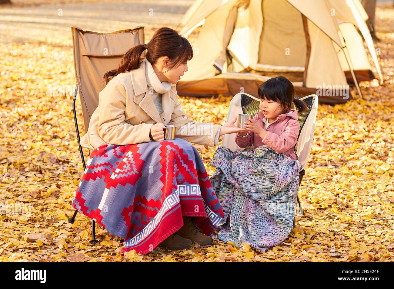 Japanese family at campsite Stock Photo - Alamy