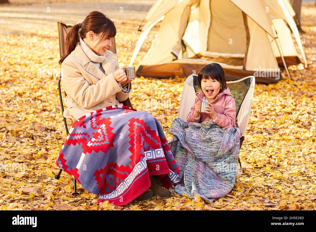 Japanese family at campsite Stock Photo - Alamy