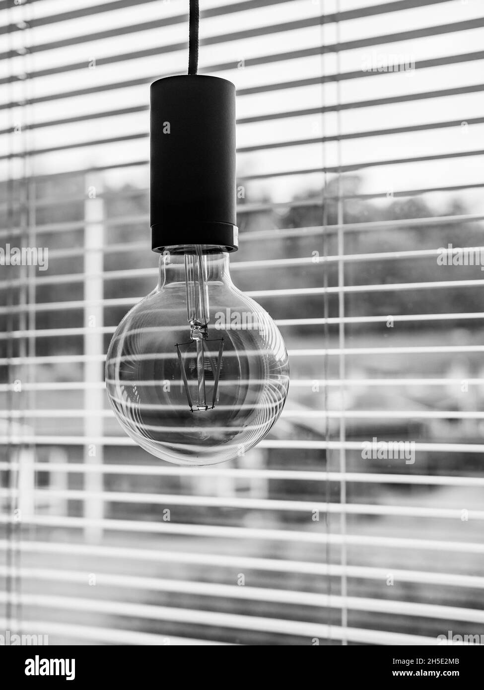 Hanging lamp bulb light Black and White Stock Photos & Images - Alamy