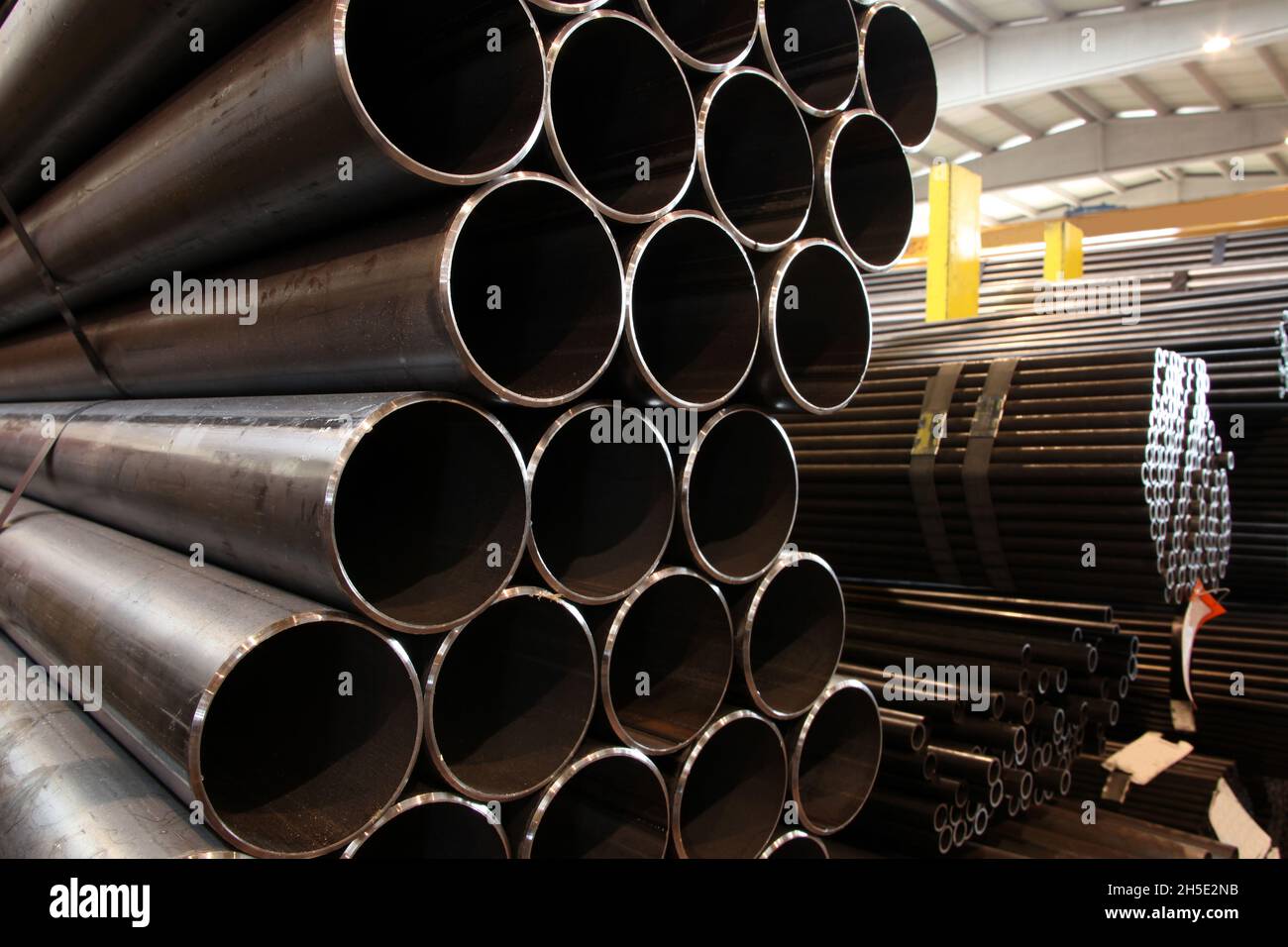 Metal pipes. Steel industry background Stock Photo - Alamy