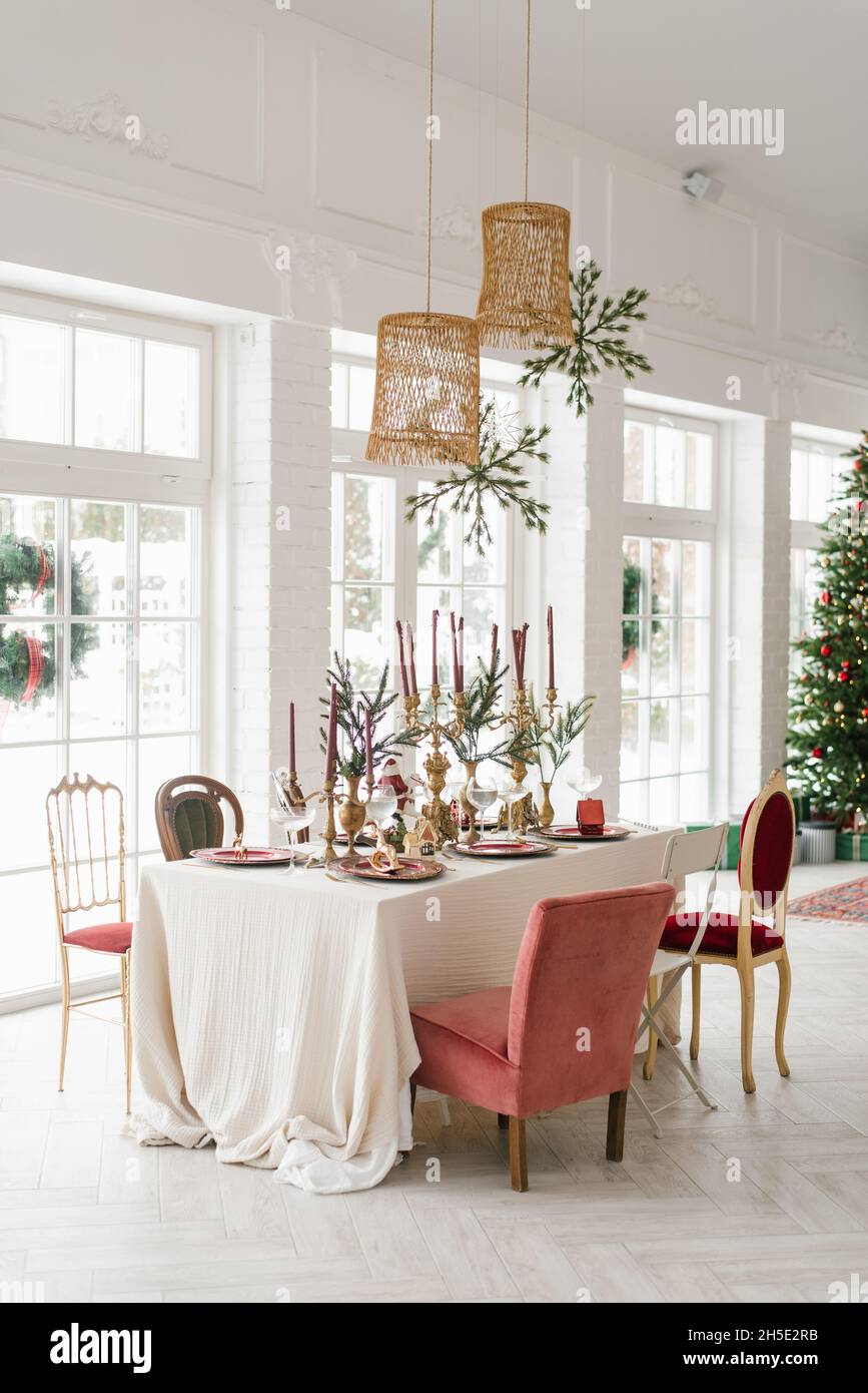 Beautifully laid table for Christmas dinner in a classic living room ...
