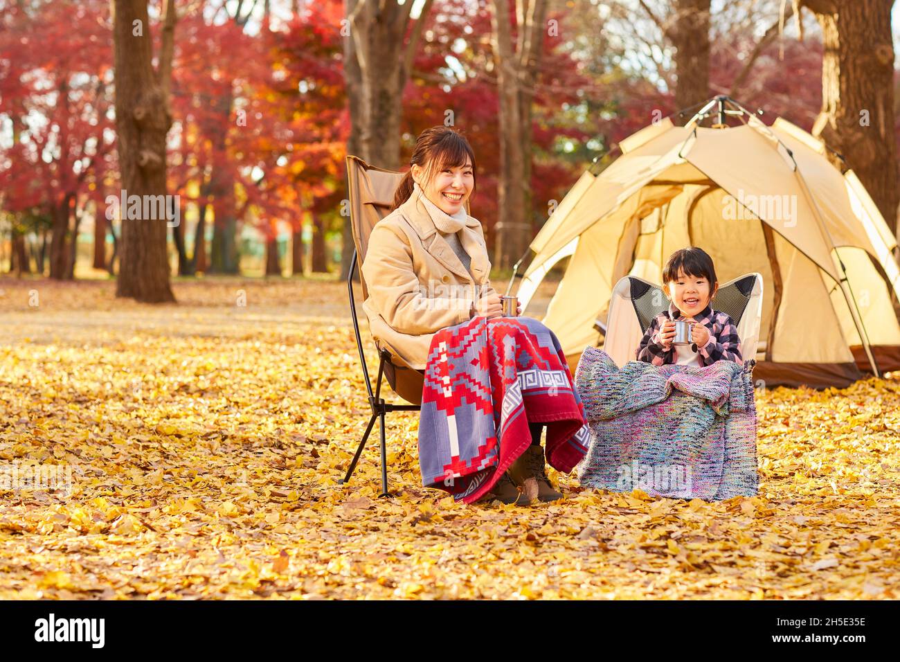 Japanese family at campsite Stock Photo - Alamy