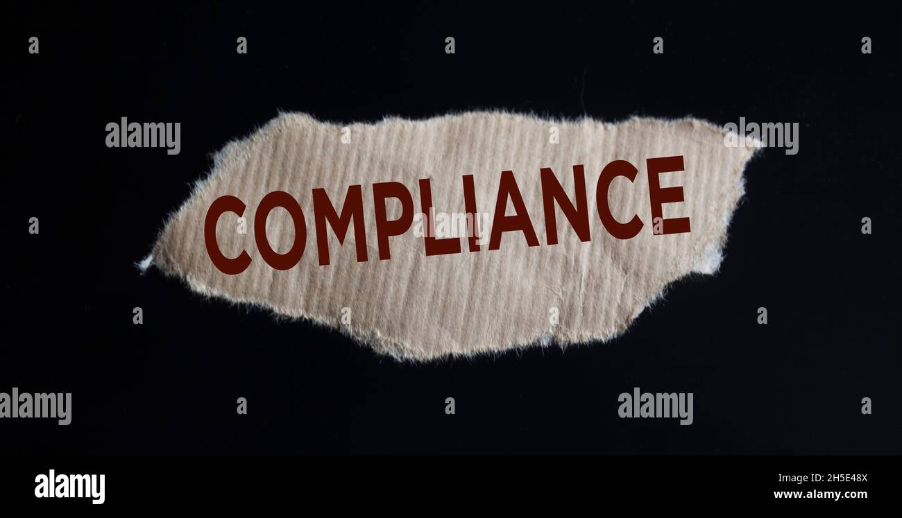 Compliance ,text written on torn paper and black background Stock Photo ...