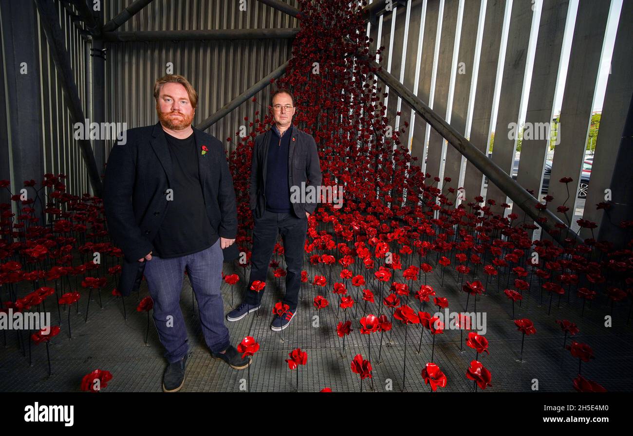 Artist Paul Cummins (left) and Designer Tom Piper stand beside "Poppies ...