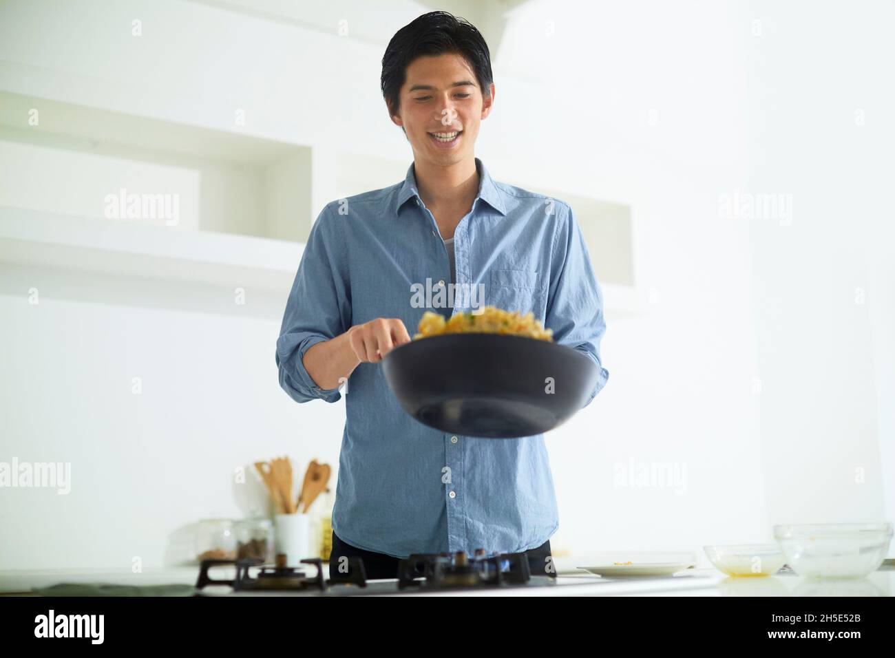 Asian man cooking fried rice hi-res stock photography and images - Alamy