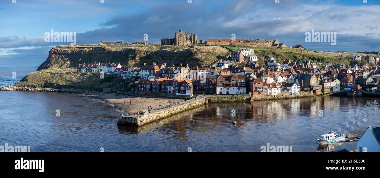 Whitby East shoreline at dawn as the town starts the working day Stock ...
