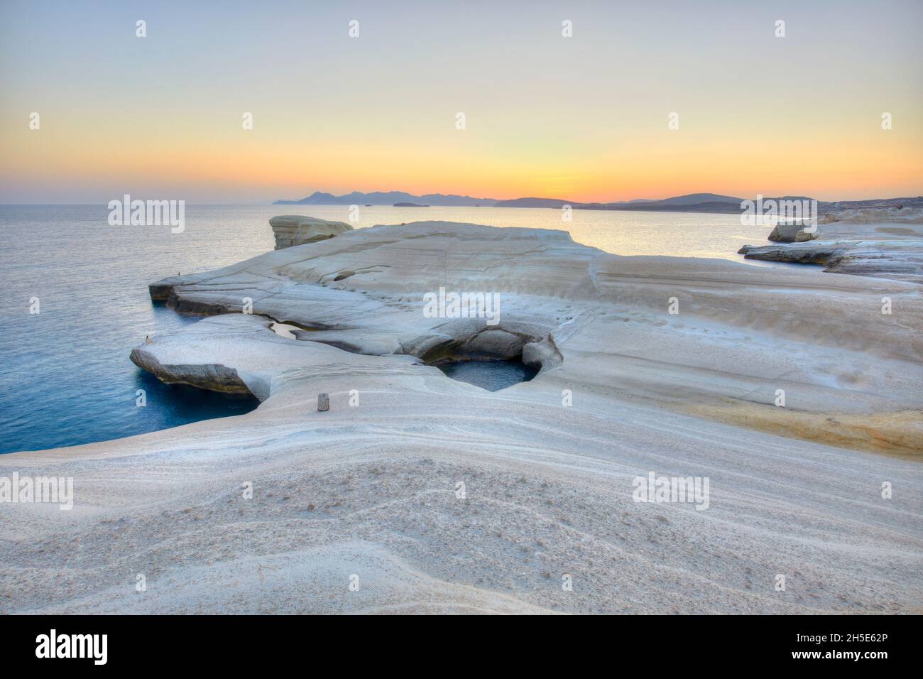 The white cliffs of Sarakiniko Beach at sunrise, Milos, Greece Stock ...