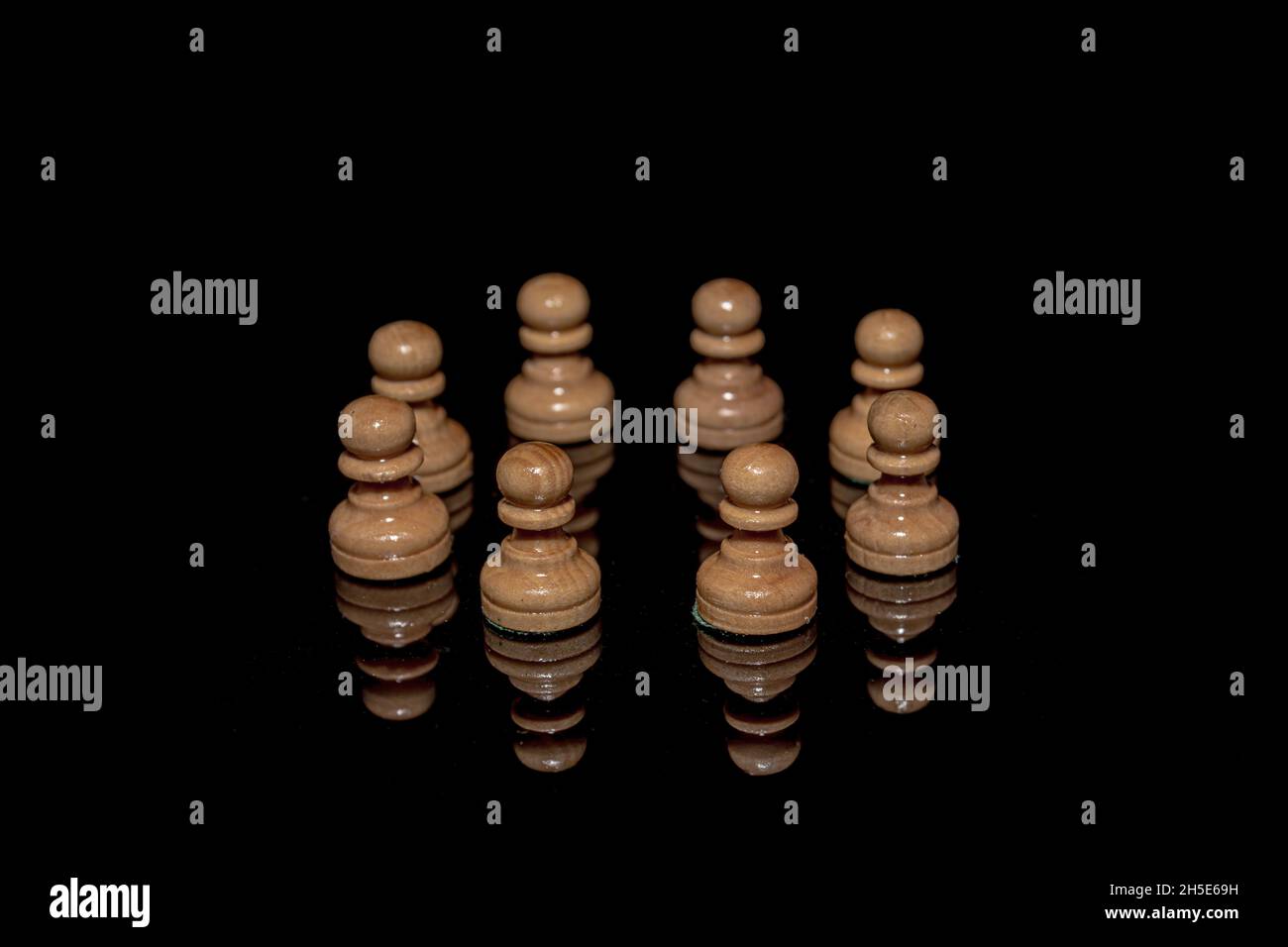 pawn forming circle with reflection in black background Stock Photo - Alamy